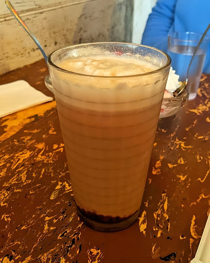 This isn't just a root beer float—it's a frothy time machine that transports you back to soda fountain days with one sip.
