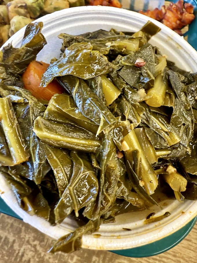 Collard greens that have clearly been hanging out with smoked pork. These aren't your sad cafeteria vegetables—they're the side dish equivalent of a Southern hug.