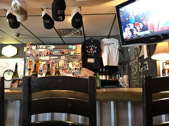 The counter where magic happens. Those Maple & Motor t-shirts aren't just merch—they're badges of honor for true believers.