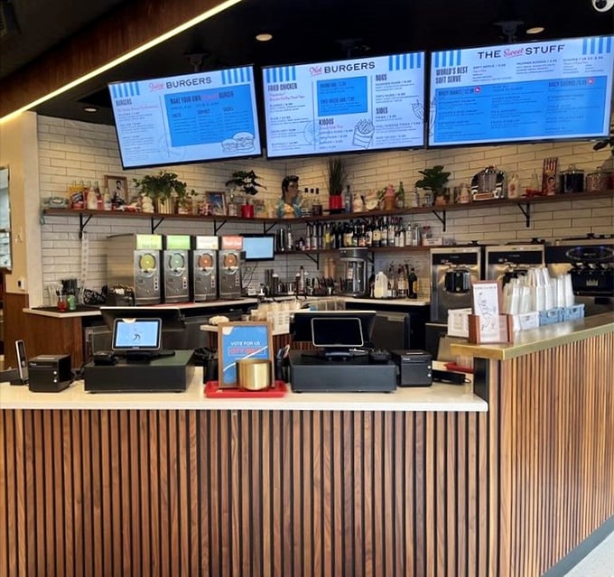 Where burger magic happens—a counter that separates mere mortals from the wizards who transform simple ingredients into handheld joy.