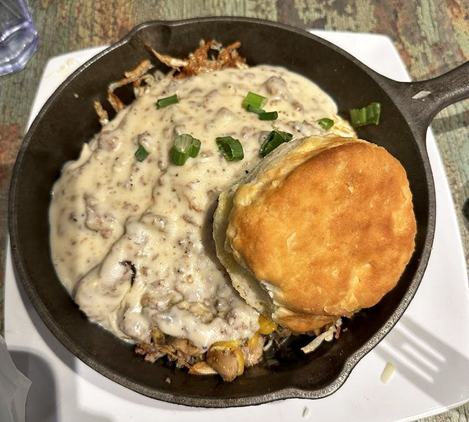 This country-style skillet and golden biscuit combo isn't just breakfast—it's a Southern hug on a plate, complete with green onion confetti.