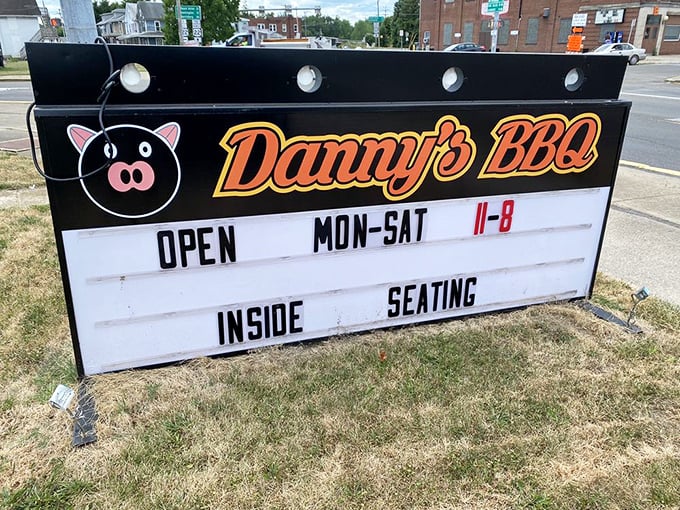 The roadside sign stands as a beacon of hope for hungry travelers—like a lighthouse, but guiding you to brisket instead of safe harbor.