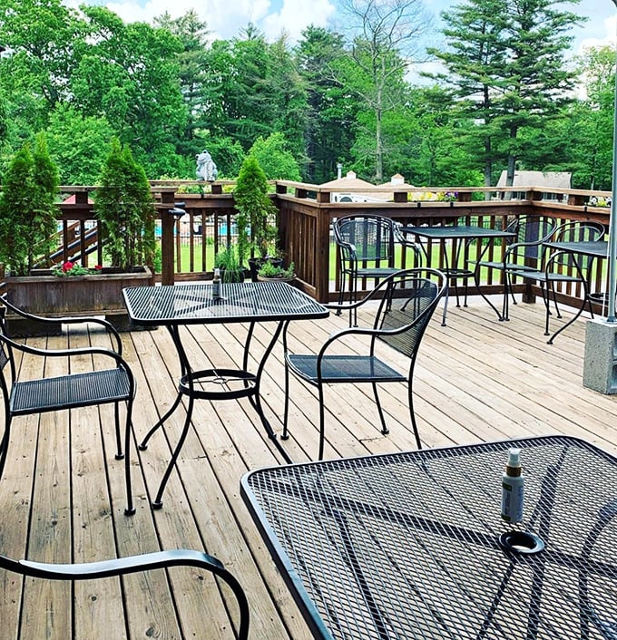 The deck offers nature's soundtrack with your meal—birds chirping approval of your excellent restaurant choice.