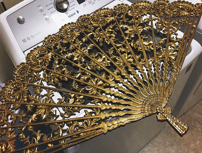 Sometimes the most unexpected treasures appear—like this ornate gold fan that probably has more stories than your favorite history podcast.