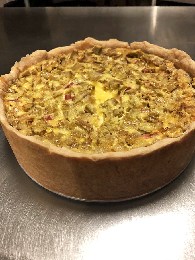 Deep dish rhubarb custard pie with a crust so perfectly flaky it deserves its own appreciation society – spring's tartness tamed by sweet, creamy custard.