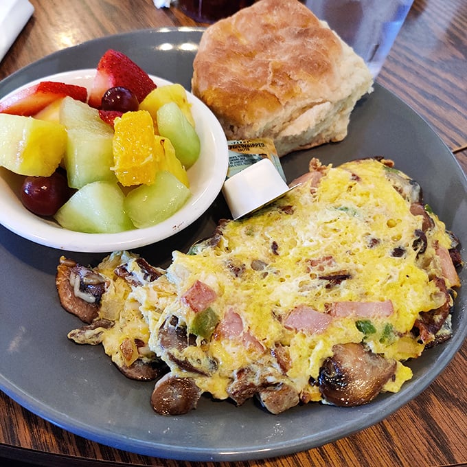 This Denver omelet with fresh fruit and a biscuit isn't just breakfast—it's morning motivation in edible form.