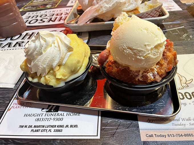 Dessert indecision has never looked so beautiful. Banana pudding with whipped cream on the left, cobbler with ice cream on the right—the Sophie's Choice of sweets.