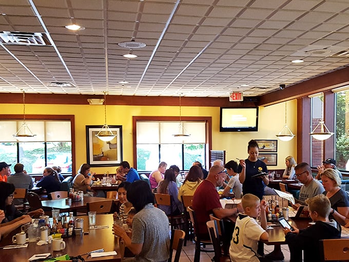 A bustling dining room filled with the breakfast faithful—proof that in Ann Arbor, pancake worship is a community affair.