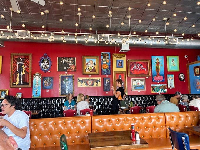 Happy diners surrounded by colorful art – this is what a true neighborhood gathering place looks like. 
