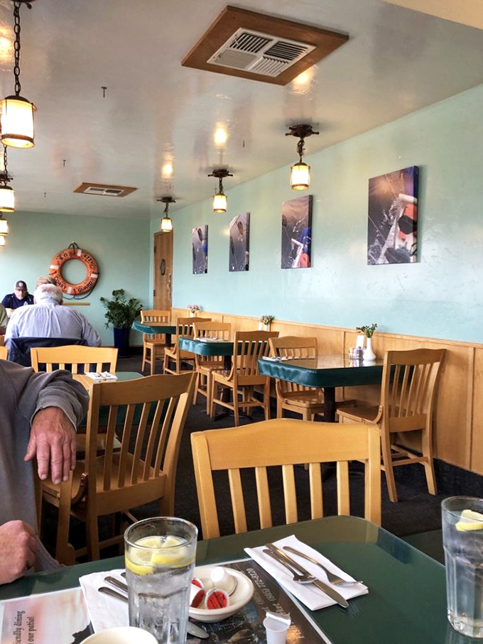 The dining room's sea-foam walls and wooden accents create the perfect backdrop for conversations that inevitably circle back to "How's your food?"