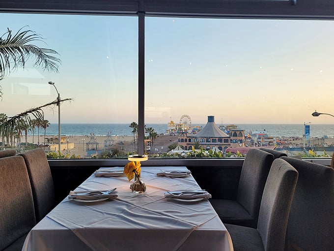 Window-side tables offer million-dollar views of the Santa Monica Pier, where Ferris wheels spin against endless blue horizons.