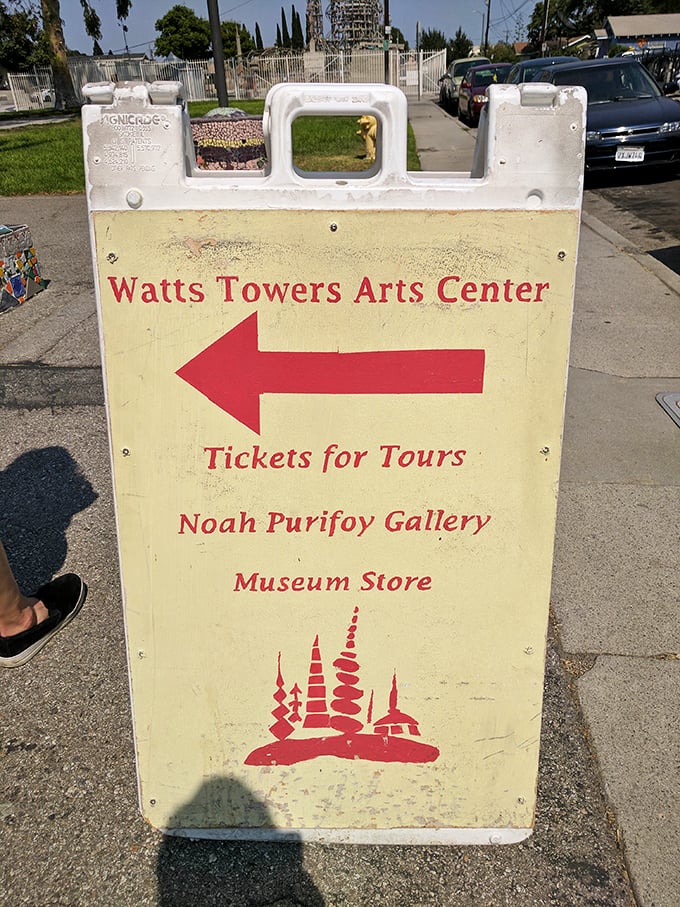 Even the directional signage has personality—this cheerful yellow marker points the way to tours, galleries, and inevitable amazement.