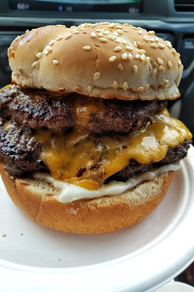 This double cheeseburger isn't just a meal – it's a monument to American excess done exactly right. Two patties, twice the pleasure.