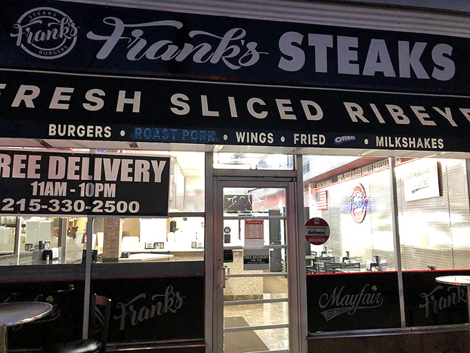 Night or day, Frank's beckons the hungry. The illuminated storefront promises fresh ribeye and free delivery—two beautiful phrases in any language.