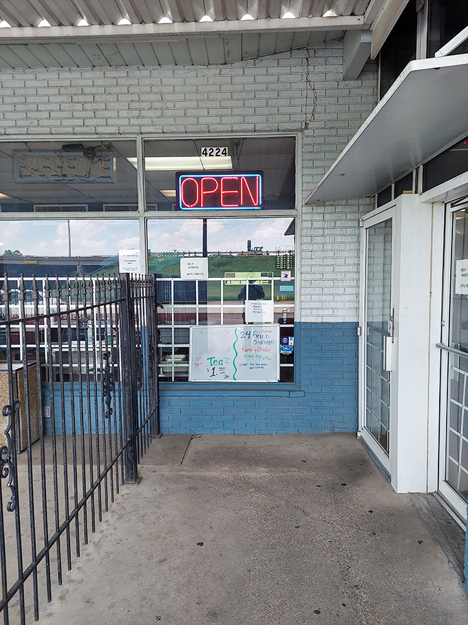 The entrance promises no pretension—just an "OPEN" sign that might as well say "Get in here and eat something amazing."