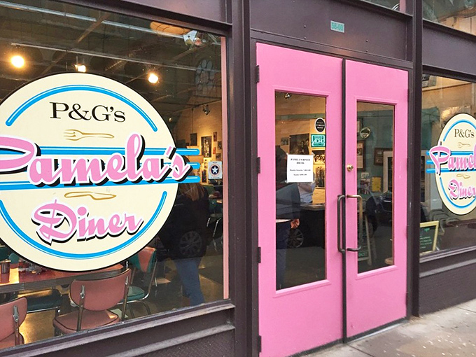 Those pink doors don't just mark an entrance—they're a portal to a breakfast dimension where pancakes have crispy edges and calories don't count.