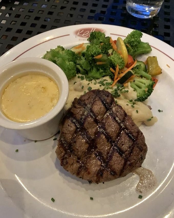 This filet mignon isn't just cooked—it's respected. Perfect grill marks, a butter-soft texture, and vegetables that aren't mere afterthoughts.