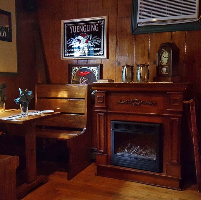 A corner fireplace flanked by Yuengling memorabilia – the perfect spot to contemplate whether you have room for that homemade cheesecake.