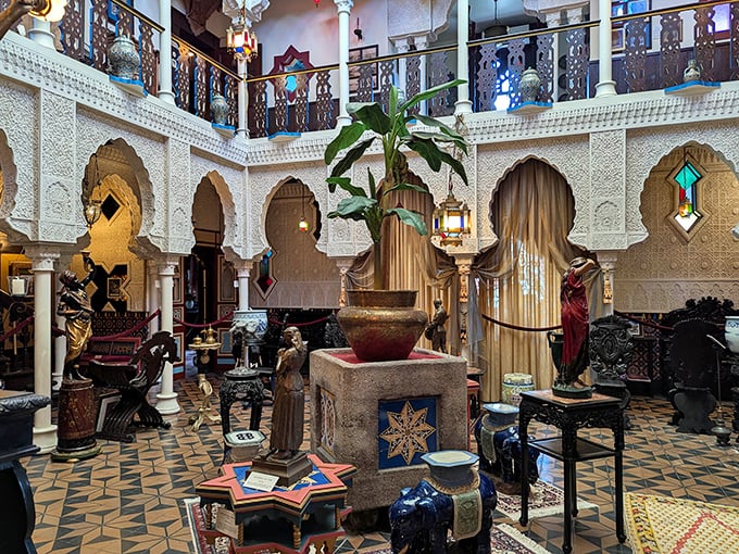 The central court showcases an explosion of patterns—star-shaped tiles, horseshoe arches, and carved columns creating a space where every glance reveals another intricate detail.