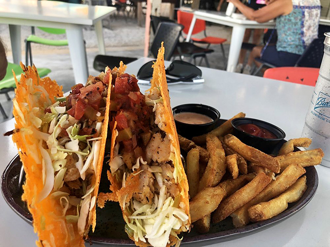 Crispy fish tacos with fresh slaw and zesty sauce—handheld happiness that captures the essence of coastal Florida in every bite.