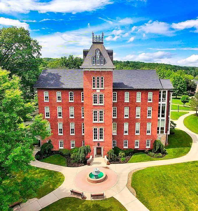 Founders Hall rises majestically from manicured grounds, its brick tower and symmetrical design embodying the timeless dignity of small-town Pennsylvania education.