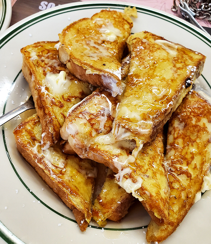 French toast that's achieved the golden-brown perfection we all aspire to in life. Crisp edges, custardy centers, and absolutely no regrets.