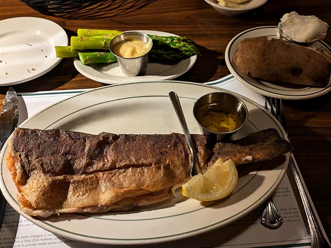 Seafood gets the same reverence as beef. This perfectly bronzed fish proves The Pine Club isn't just a one-trick culinary pony.