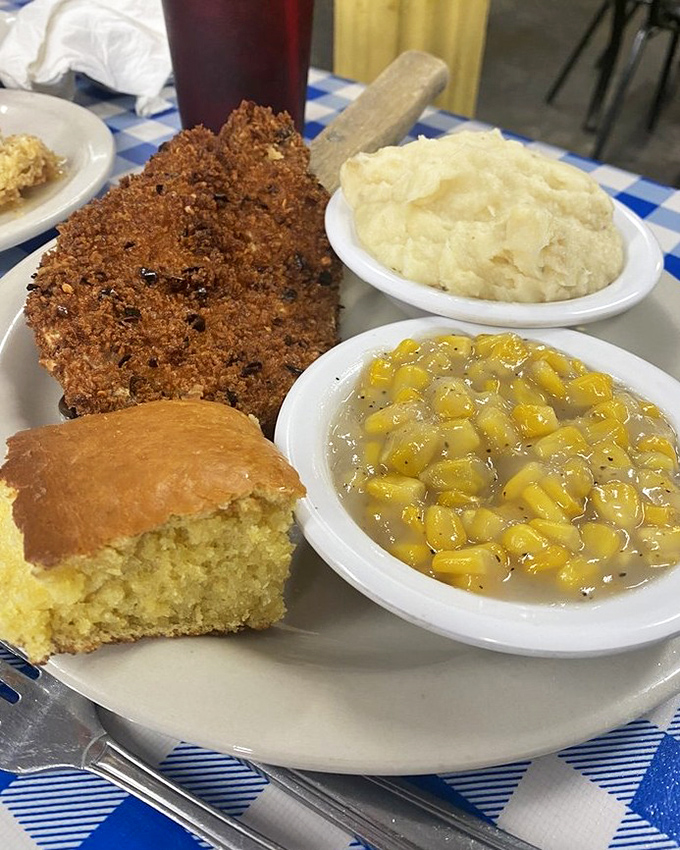This golden-crusted pork chop with creamy sides and cornbread isn't just a meal—it's edible Southern hospitality.