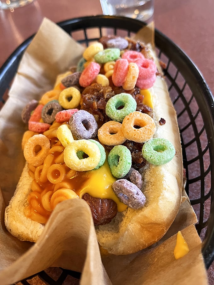 Fruit Loops on a hot dog sounds insane until you taste it – childhood breakfast meets adult brilliance.