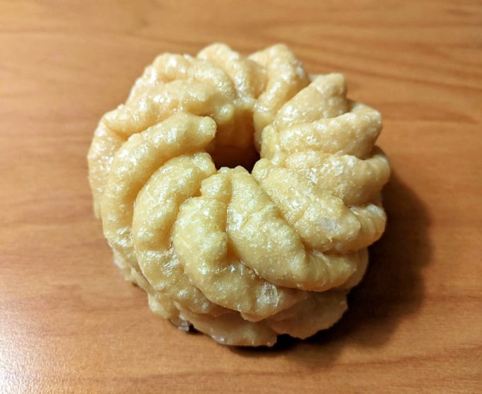 The humble cruller—a ridged wonder of fried dough that proves sometimes the simplest pleasures are the most profound.