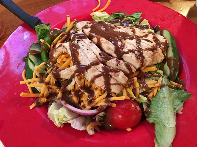 Even the salads get the barbecue treatment – grilled chicken bringing smoky dignity to what could have been just rabbit food.