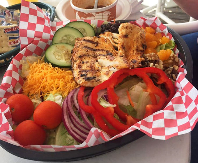 A grilled chicken salad that somehow avoids the sad fate of most "healthy options"—vibrant, fresh, and actually satisfying.