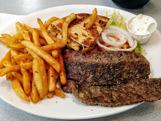 A perfectly grilled steak shares the spotlight with golden fries. Simple food executed with the confidence that comes from decades of practice.