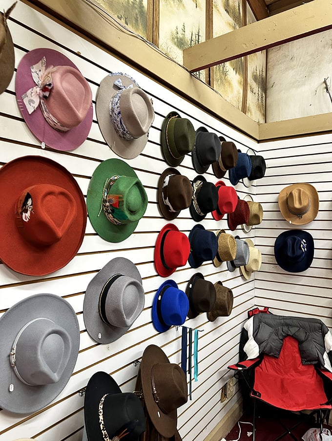 The wall of hats transforms shoppers into characters from different stories—each brim and band promising a new personality for under $30.