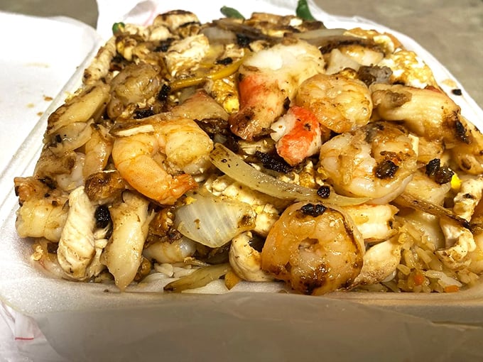 Hibachi-grilled shrimp and chicken with caramelized onions—proof that sometimes the best plate is the simplest one.