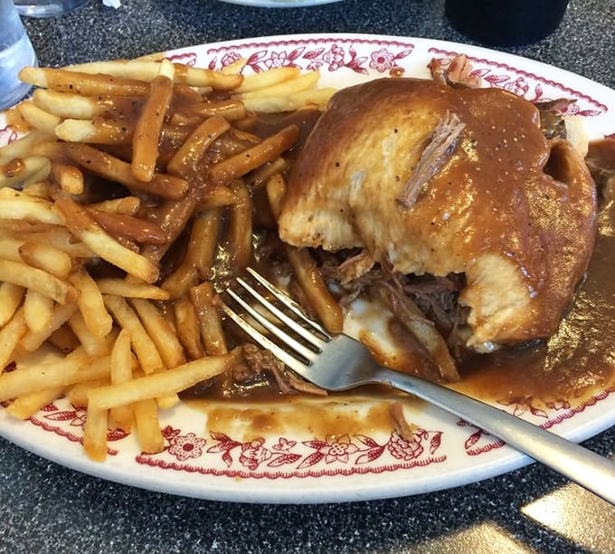 Hot roast beef swimming in gravy with a golden island of fries. The kind of lunch that necessitates a nap afterward—and makes it entirely worth it.