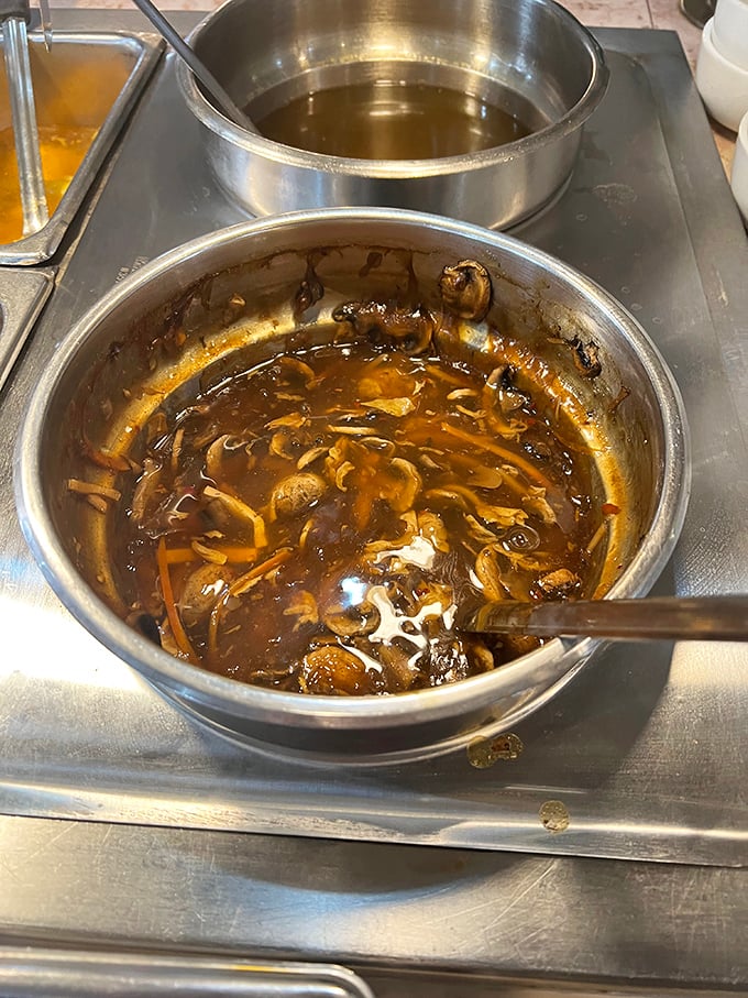 
Hot and sour soup that doesn't mess around—rich broth swimming with mushrooms and seasonings that clear sinuses and warm souls simultaneously. 
