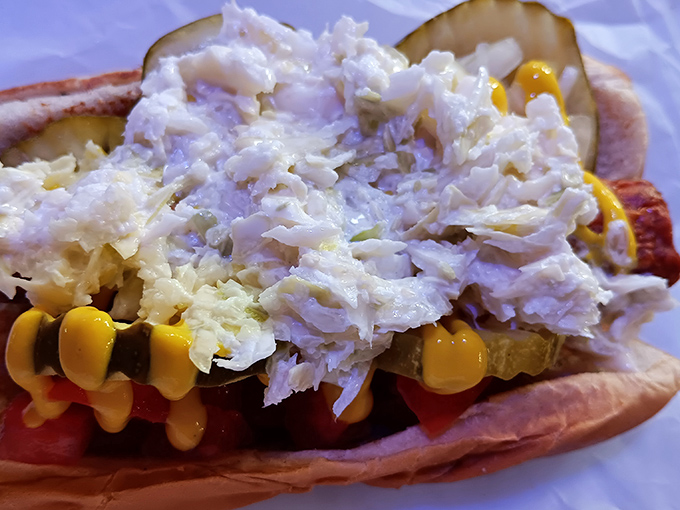 This isn't just a hot dog—it's a masterpiece of toppings architecture, where coleslaw, mustard and relish create a symphony of flavors in every bite.
