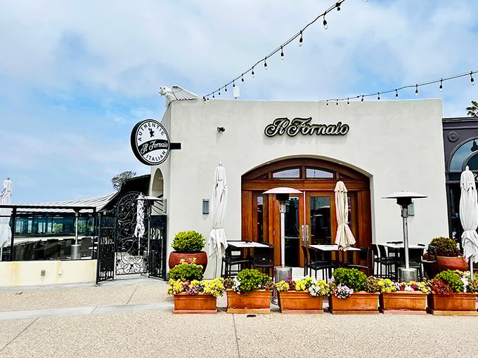 Il Fornaio's white-washed walls and string lights create the perfect stage for carb-loading with an ocean breeze – pasta paradise found.