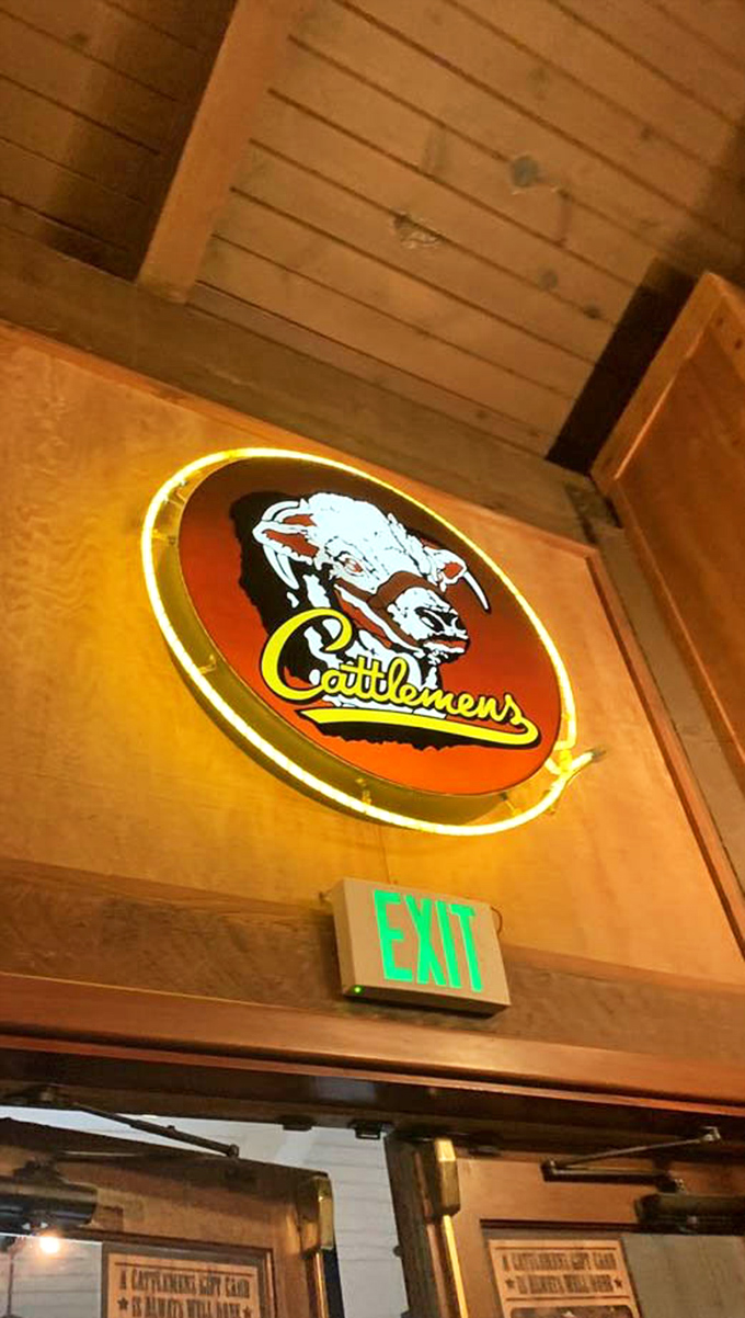 The glowing Cattlemens sign inside isn't just illumination—it's a beacon guiding you toward your carnivorous destiny.