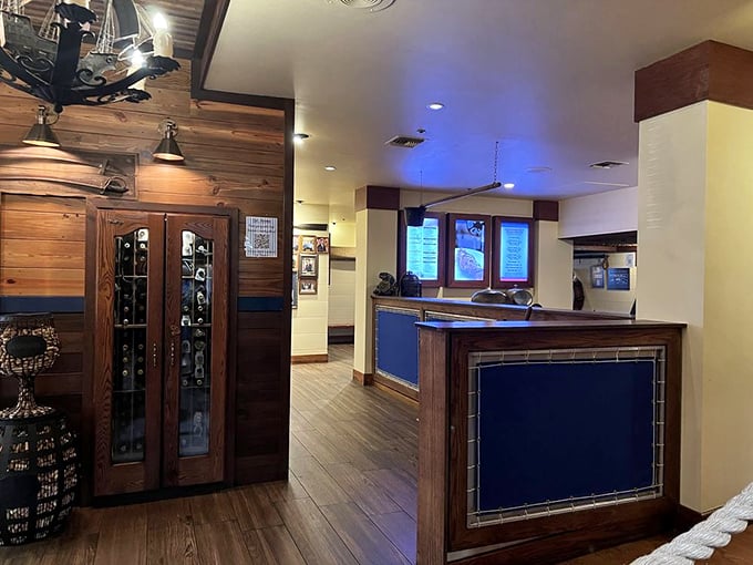 Wood, tile, and nautical blue accents create an atmosphere that's both upscale and comfortable—like a yacht club that actually wants you there.