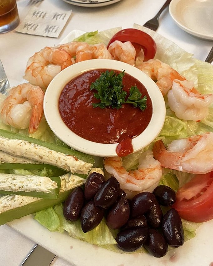 A shrimp platter that's basically a seafood greatest hits album. The cocktail sauce in the center isn't optional—it's essential to the experience.