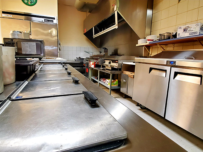 The kitchen battlefield where pizza magic happens. Clean, efficient, and ready for the dinner rush—this is where the dreams are made.
