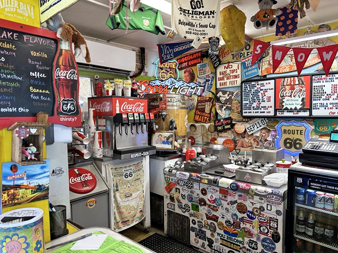 The beating heart of roadside happiness, where soda fountains and hand-drawn signs remind us that some things shouldn't be upgraded.