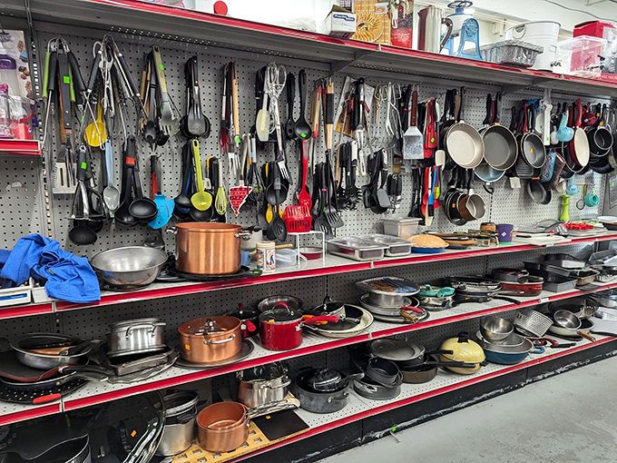 Kitchen tools hanging like culinary possibilities. That copper pot might have made someone's famous spaghetti sauce—now it could make yours.
