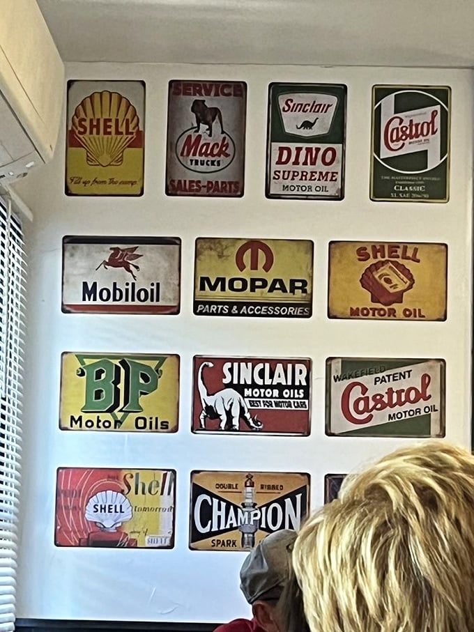 Vintage automotive signs create a museum-like backdrop that reminds you this place has been fueling humans long before anyone worried about gluten.