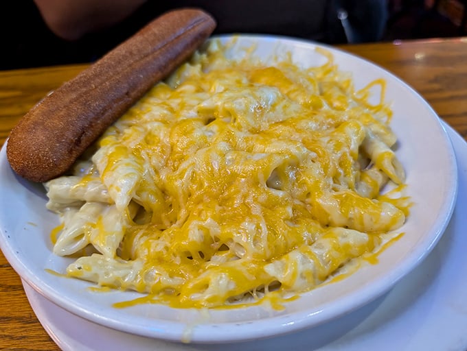 Mac and cheese that doesn't just comfort—it embraces you like that favorite sweater you've had since college, only much more delicious.