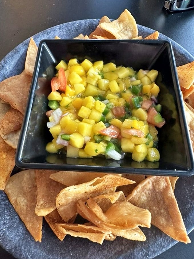 Fresh mango salsa and homemade tortilla chips—a bright, zesty appetizer that brings sunshine to the table regardless of Pennsylvania's weather outside.