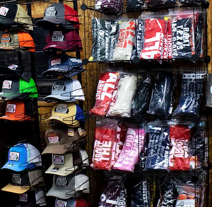 Cooper's merchandise—because sometimes a T-shirt is the only way to prove to skeptical friends back home that yes, the barbecue was actually that good.