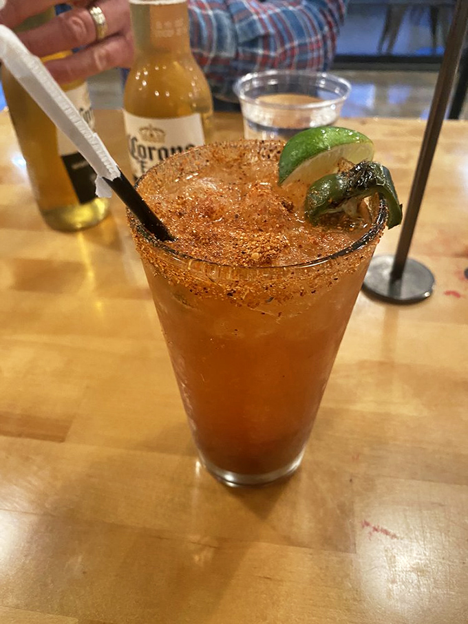 This isn't just a cocktail—it's a spice-rimmed flavor explosion that's ready to cut through all that barbecue richness.